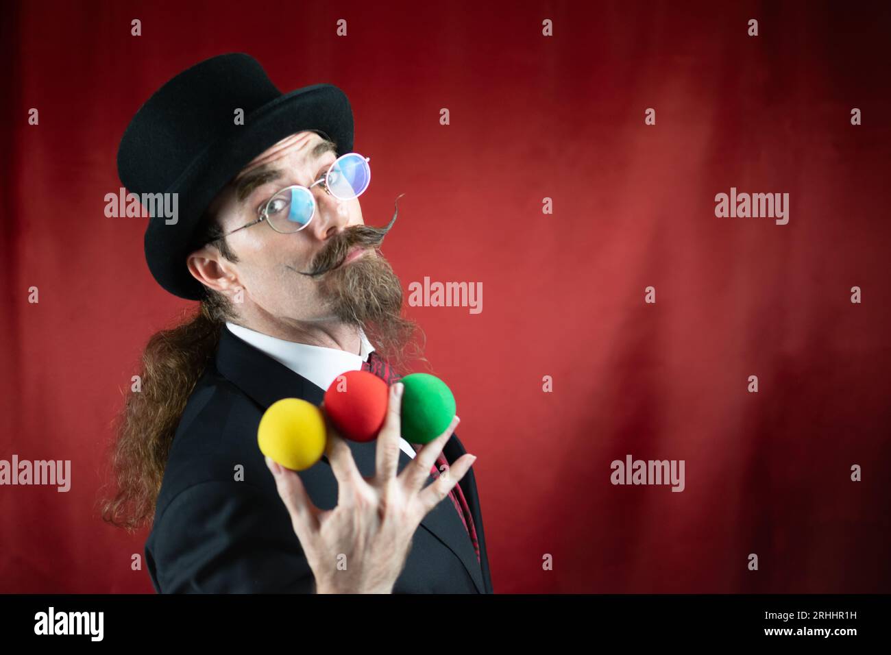 Vintage Caucasian Magician with top hat, glasses and mustache with ...