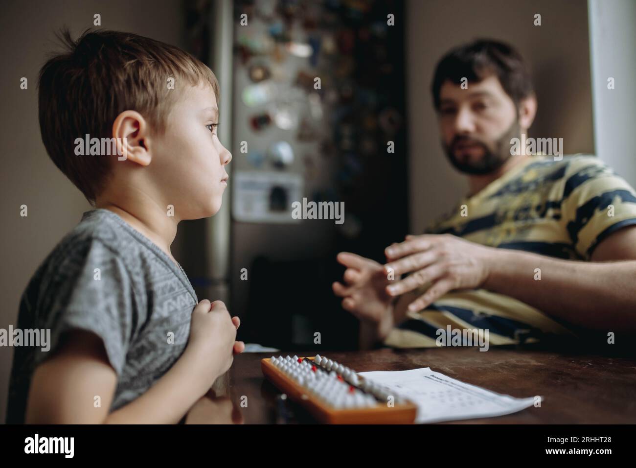 cute little caucasian boy doing his mental arithmetic homework with ...