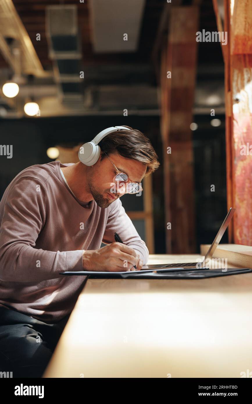 Male architect working on a project in a coworking space. business man ...