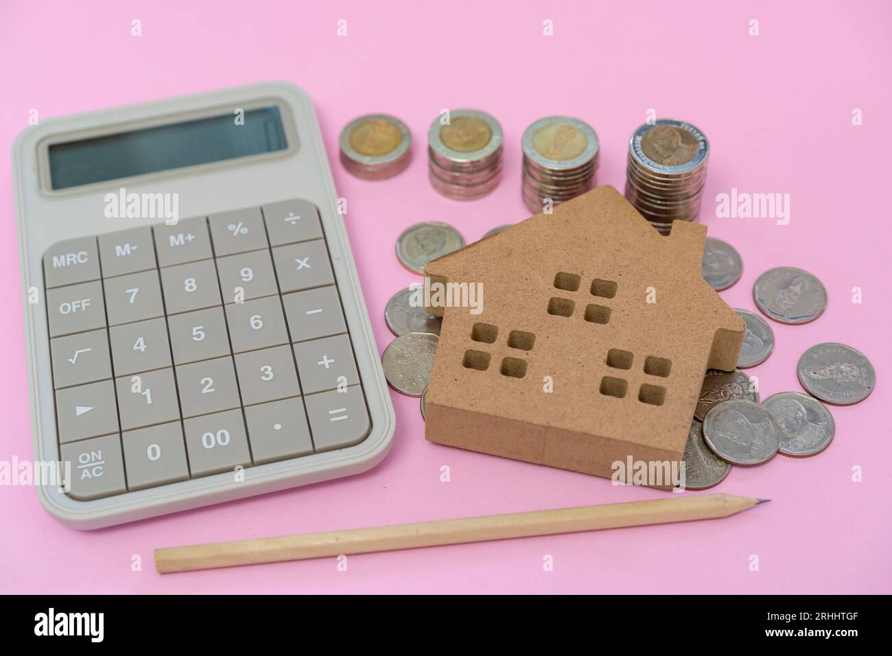Money coins and calculator on pastel pink background Stock Photo - Alamy