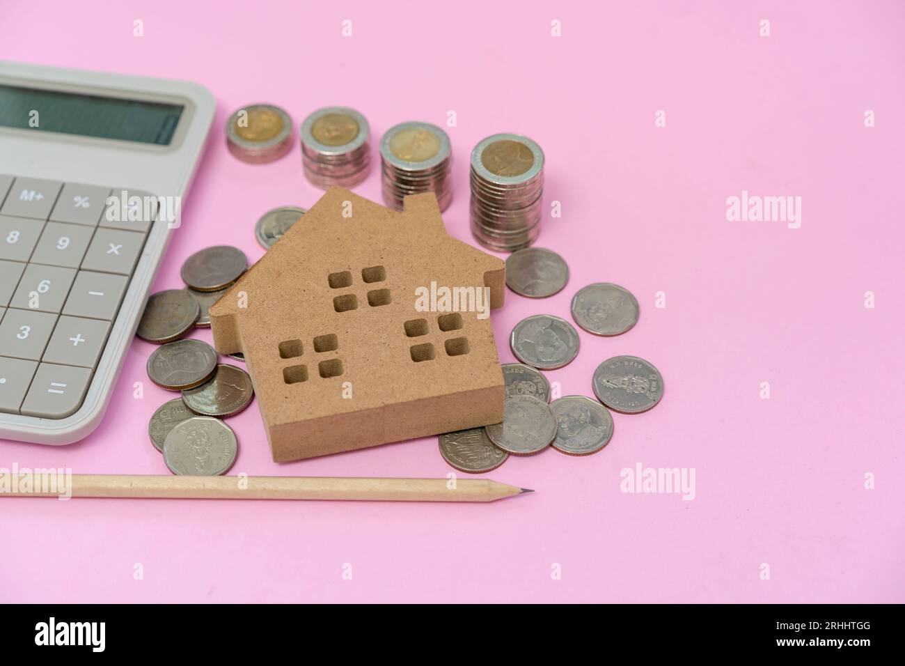 Money coins and calculator on pastel pink background Stock Photo - Alamy
