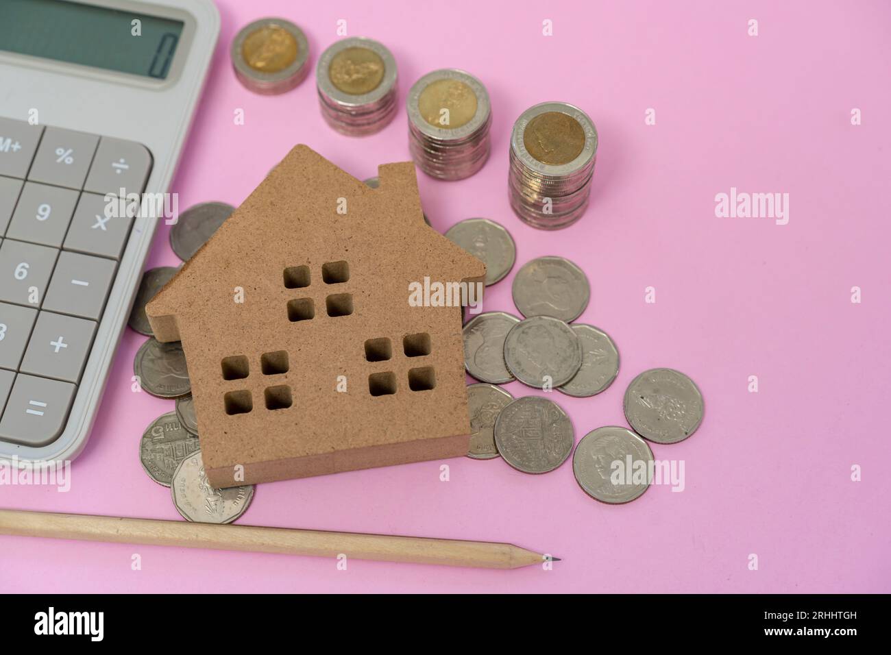 Money coins and calculator on pastel pink background Stock Photo - Alamy