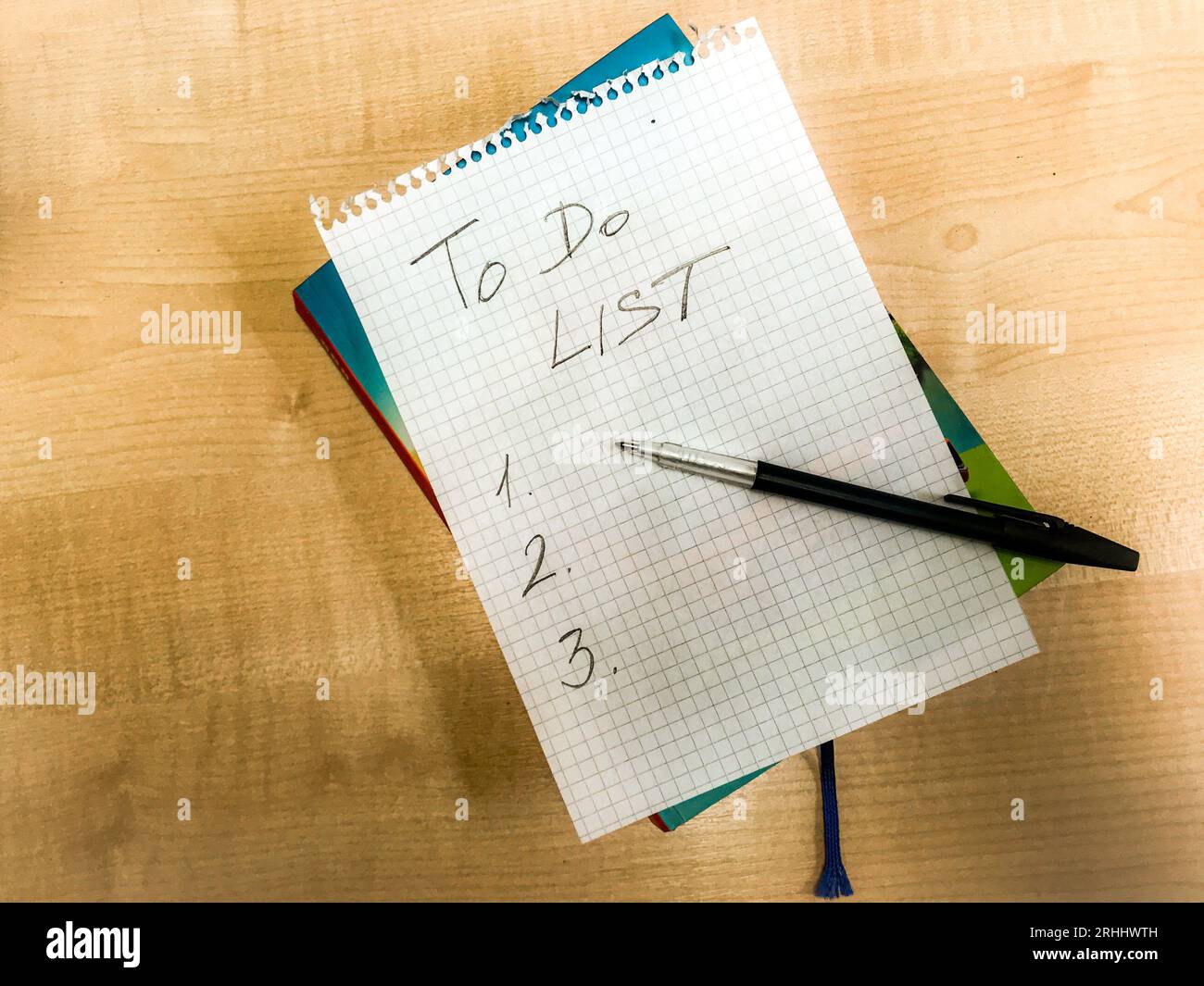 to do list checklist hand written on notepad paper lay on wooden table ...