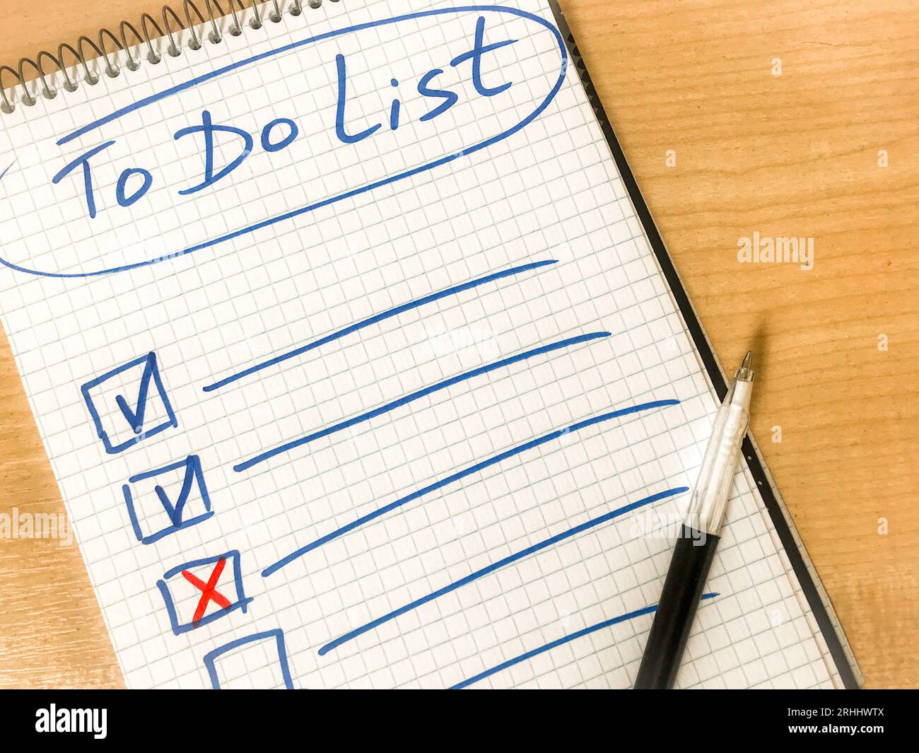 to do list checklist hand written on notepad paper lay on wooden table ...