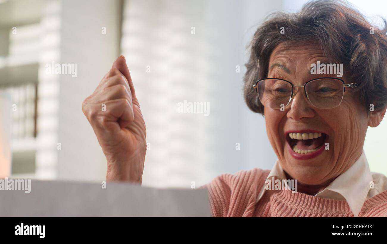 Happy Caucasian old woman reading paper letter middle-aged retired lady ...