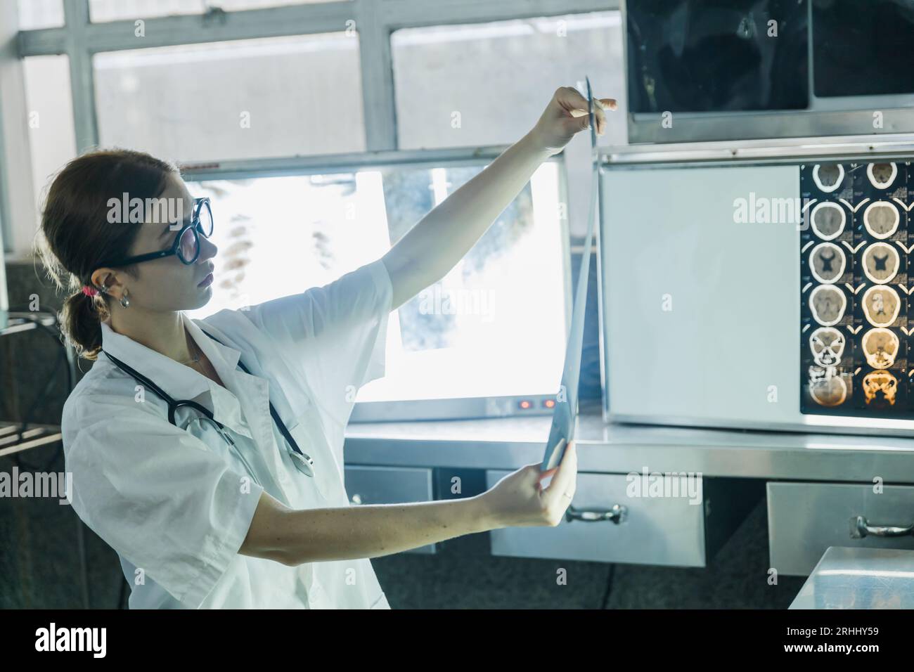 Female doctor check on scan results on monitors in laboratory Stock ...