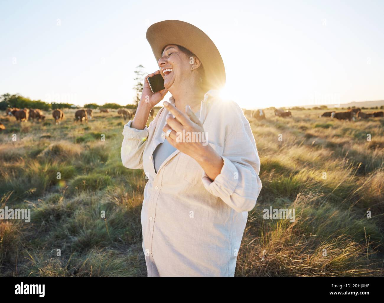 Cow, farmer and woman with phone call in countryside and person smile ...