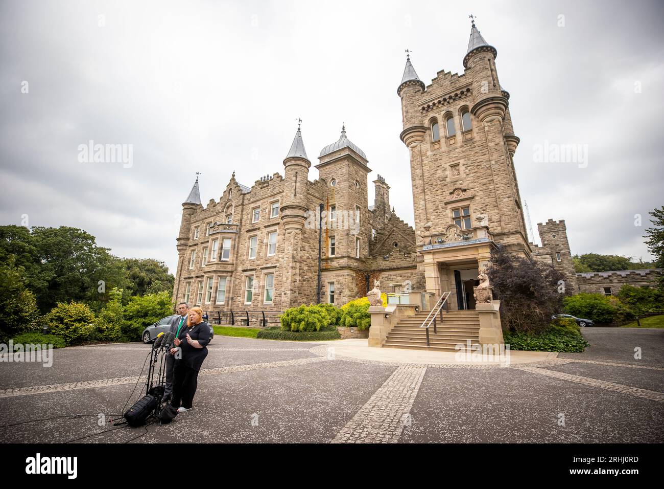 Alliance Party leader Naomi Long and Andrew Muir speaking to the media ...