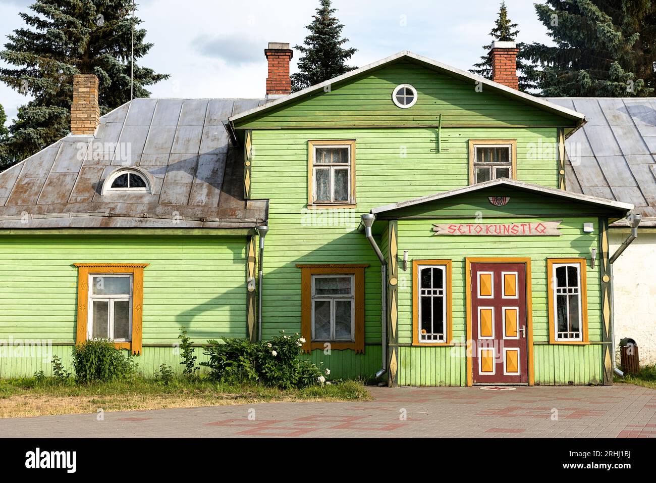 Traditional green wooden Seto house in Obinitsa village close to the border with Russia, Estonia ...