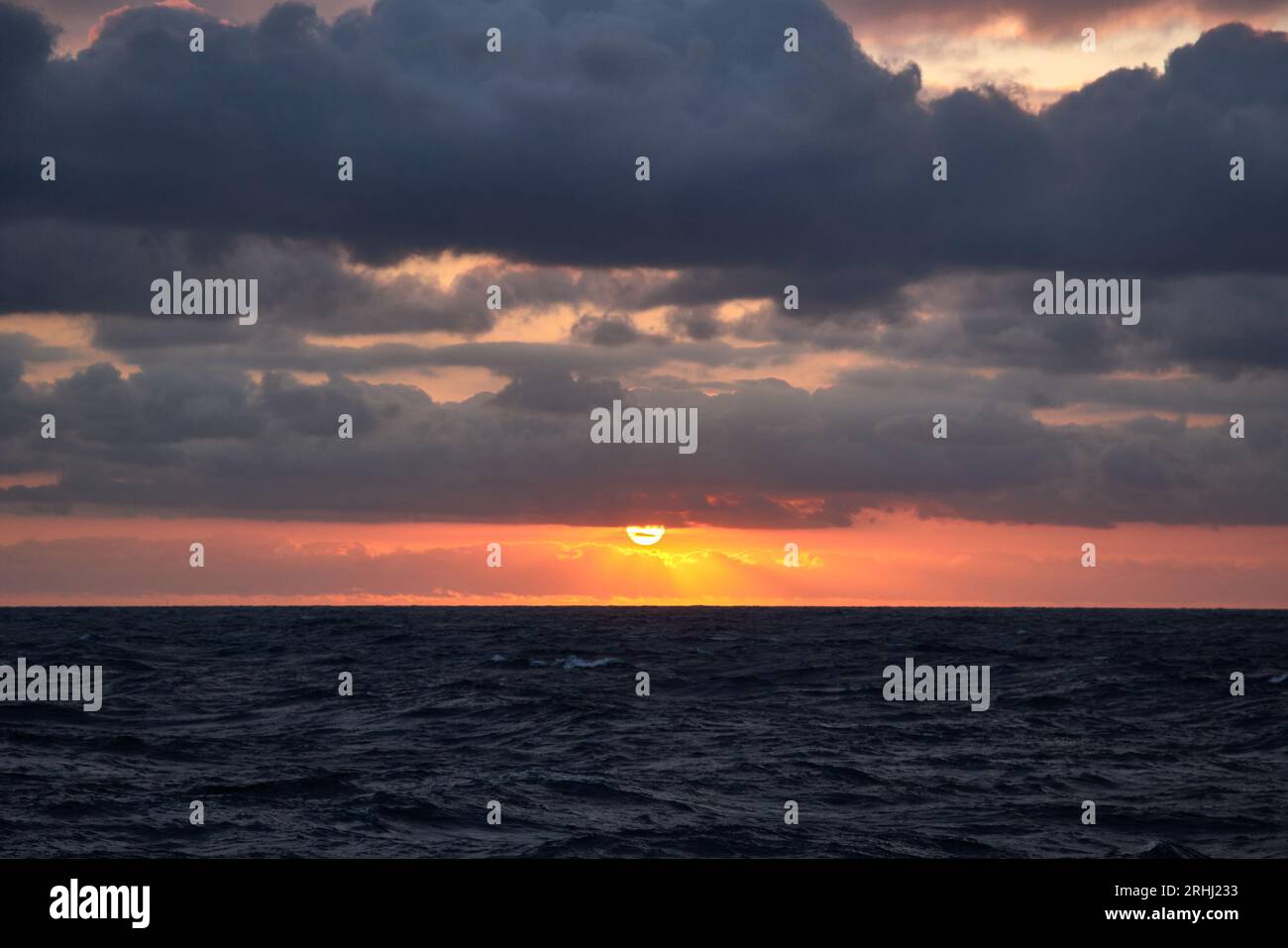 Colorful red and orange sunset with dark blue sky in the deep blue ...