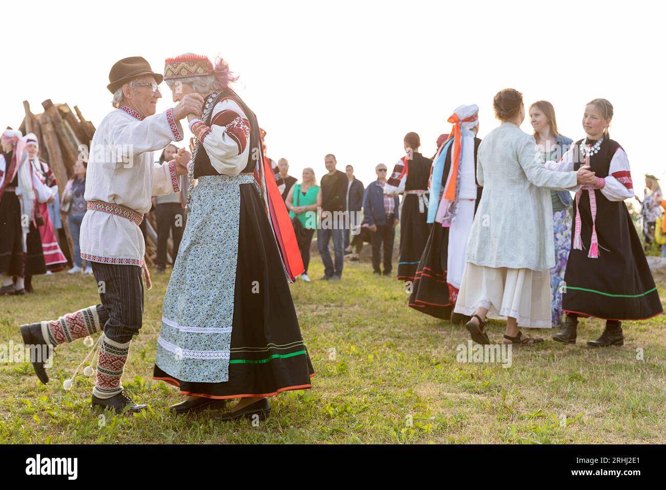 People in traditional seto estonian costumes dancing, celebrating ...