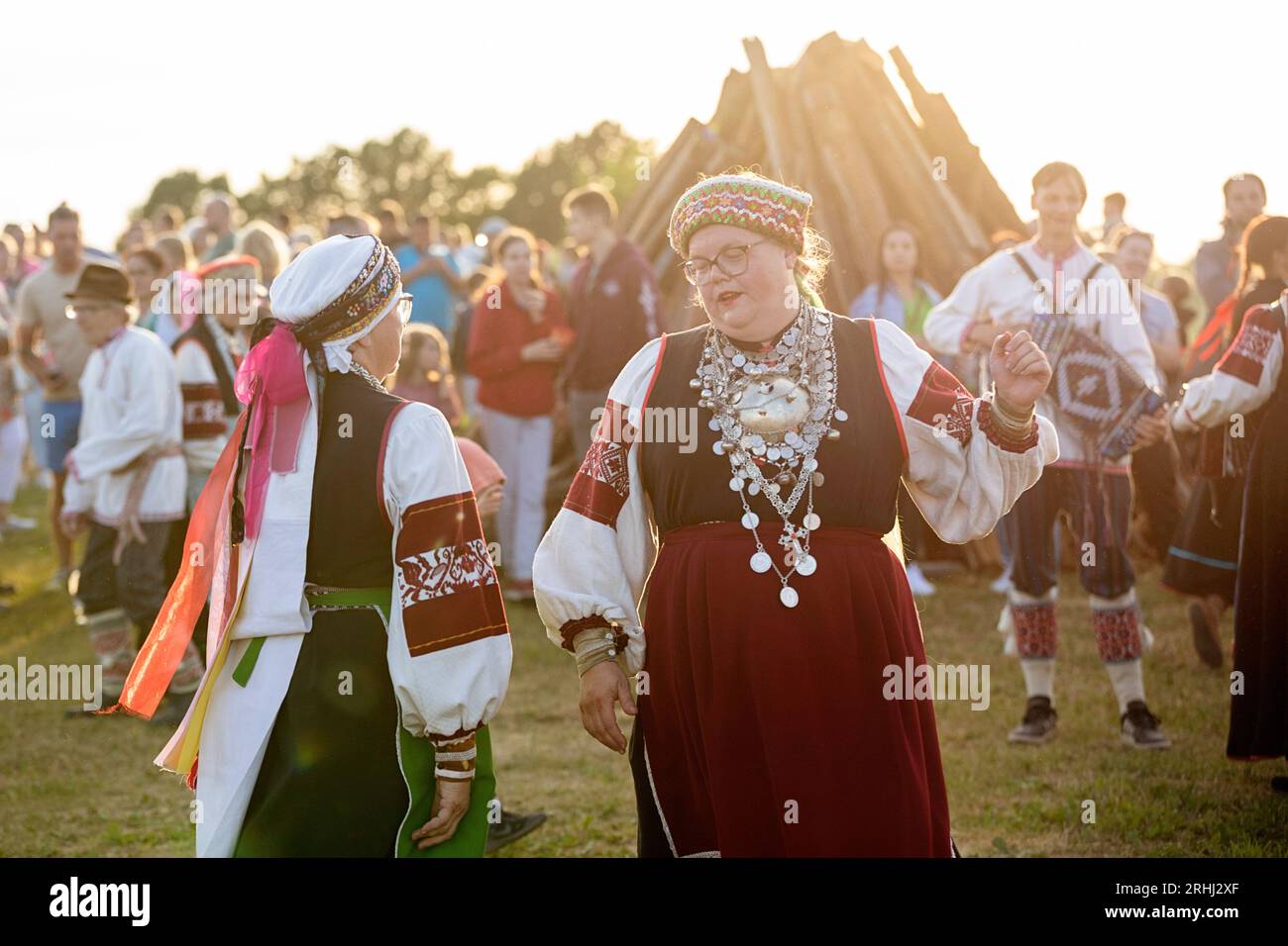 Locals in traditional seto estonian folk clothing dancing, celebrating ...