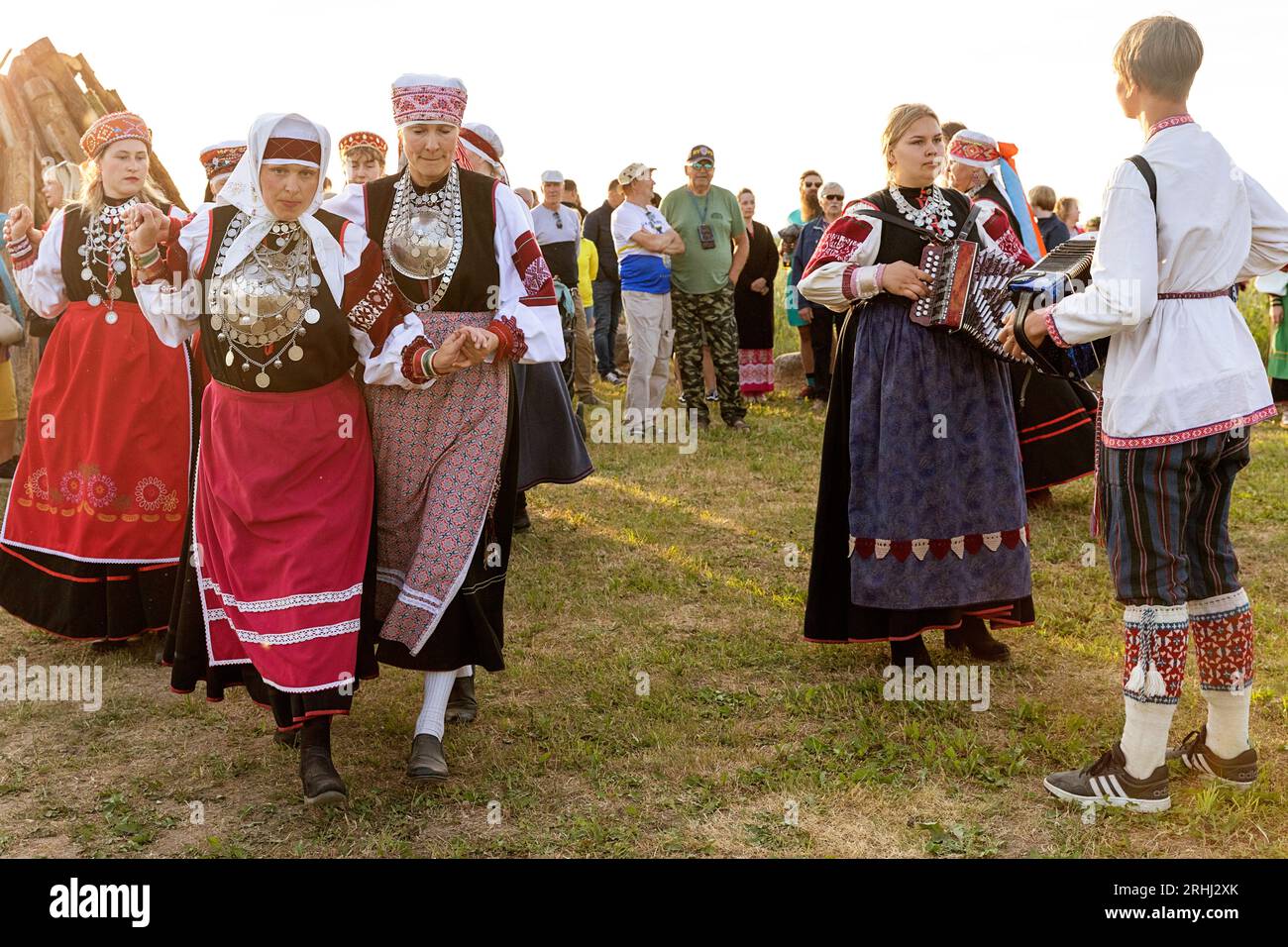 Locals in traditional seto estonian folk costumes dancing, celebrating ...