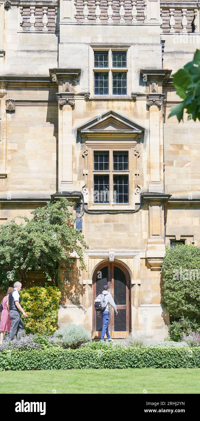 A trio of people enter the building next to New Court at Pembroke ...