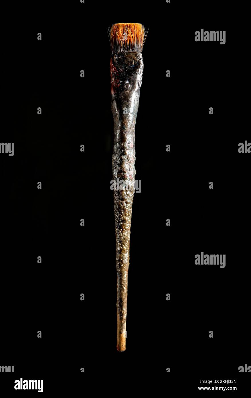 studio still life image of a single old used antique artist paint brush ...