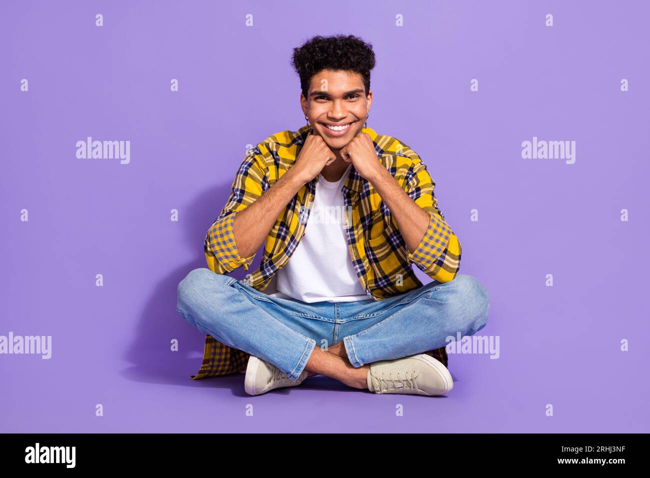 Full length portrait of cheerful peaceful person sit floor hands touch ...