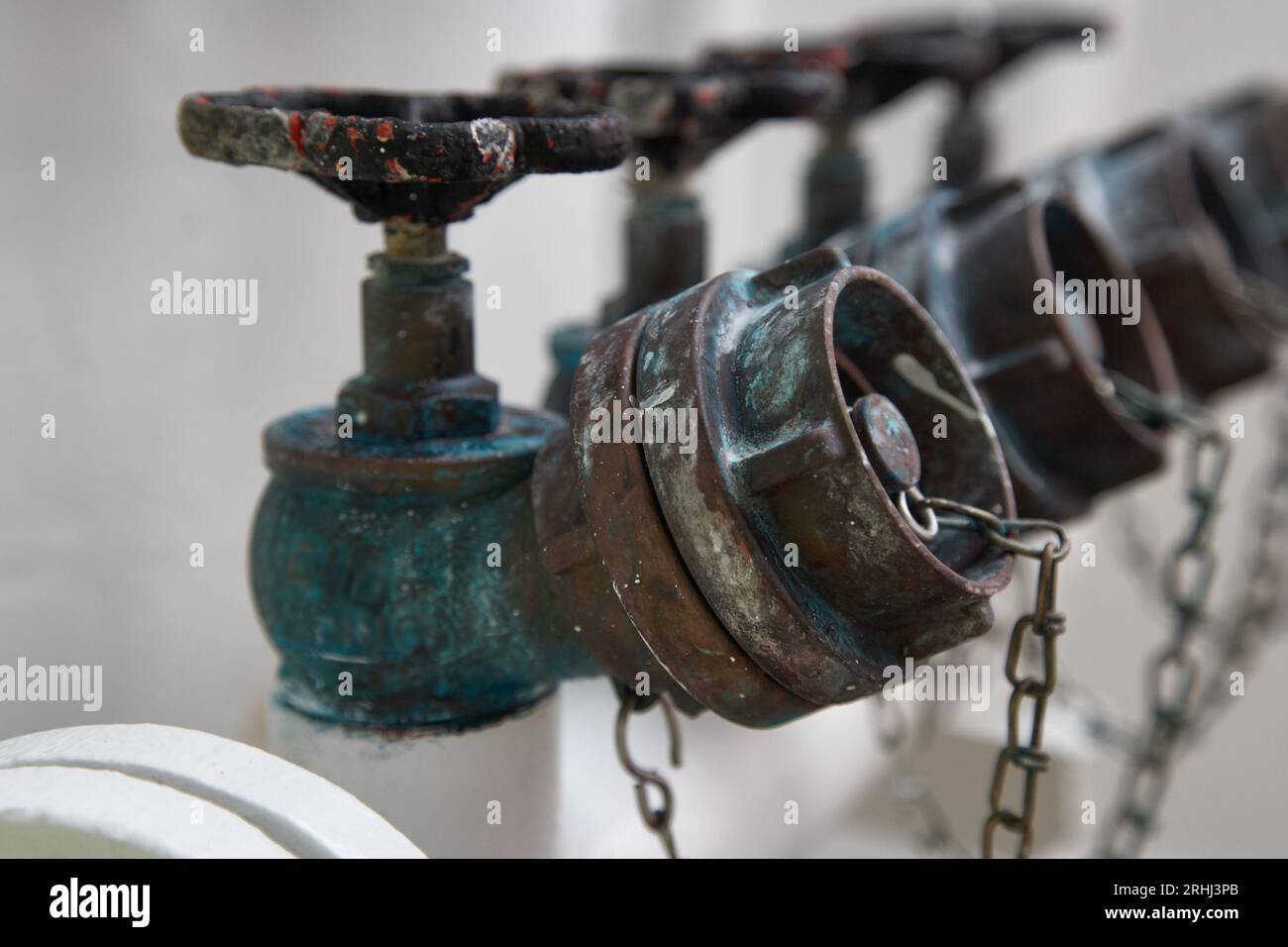 Rusty brass fire hydrant valves with securing plug to connect to water ...