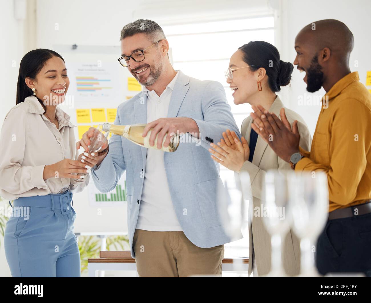 Success, champagne and applause with business people in office for ...