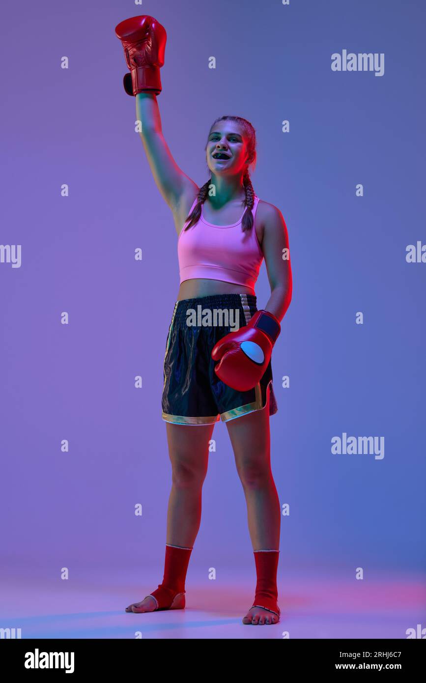 Full-length photo of teen girl, MMA fighter after winning game against ...