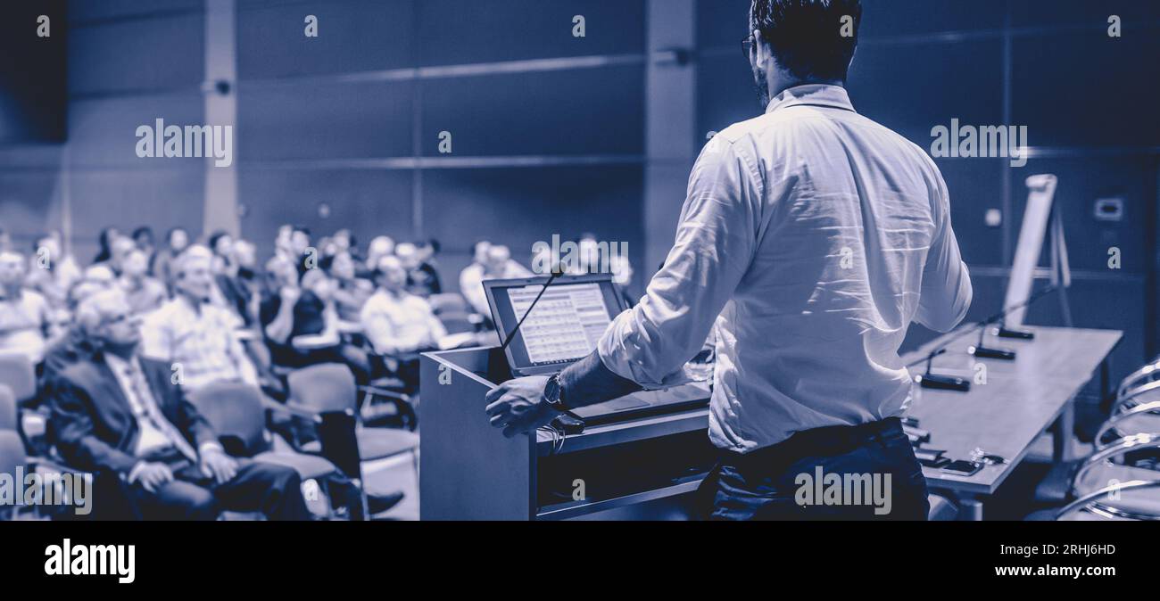 Speaker giving a talk on corporate Business Conference. Audience at the ...
