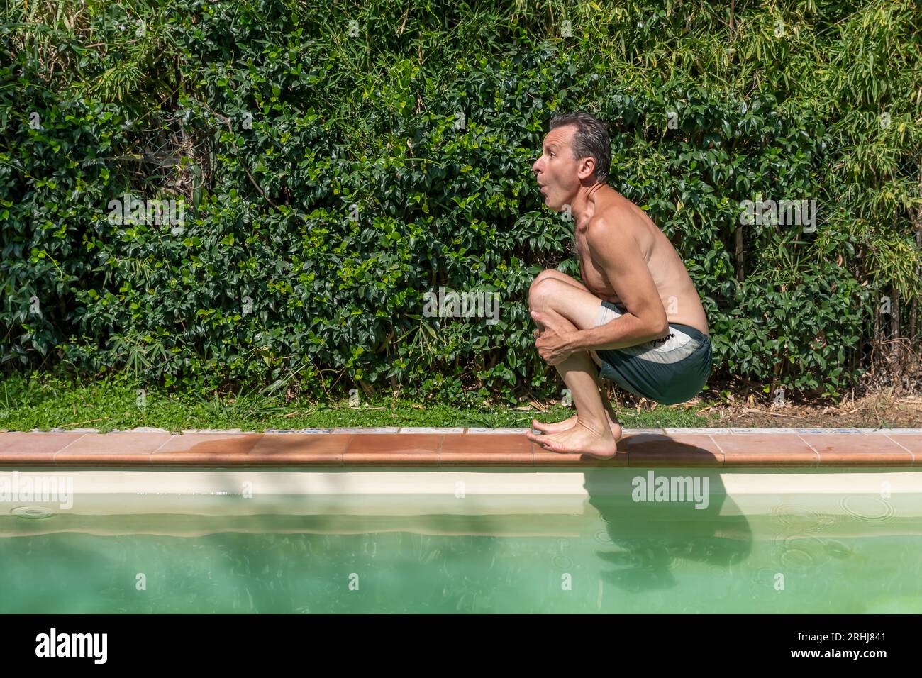 Person diving into swimming pool hi-res stock photography and images ...