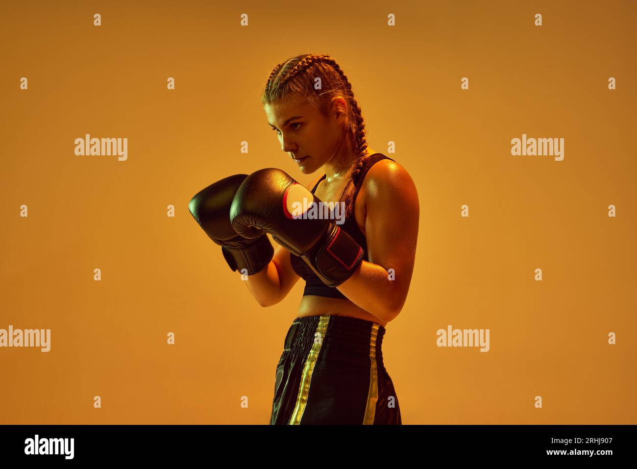 Defense position. Teen girl, concentrated MMA athlete in boxing gloves ...