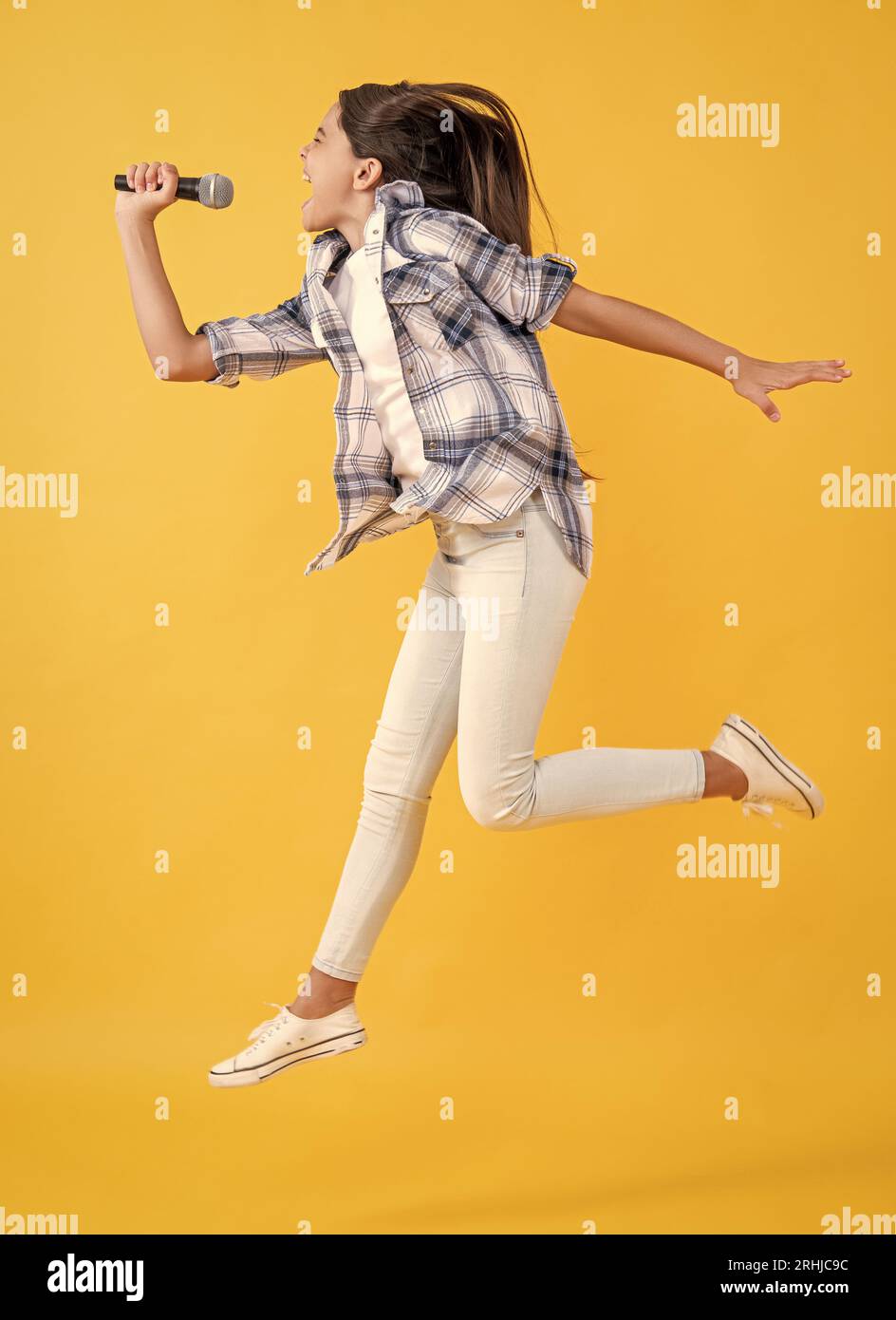 teen girl karaoke singer jumping in studio. teen girl karaoke singer on ...