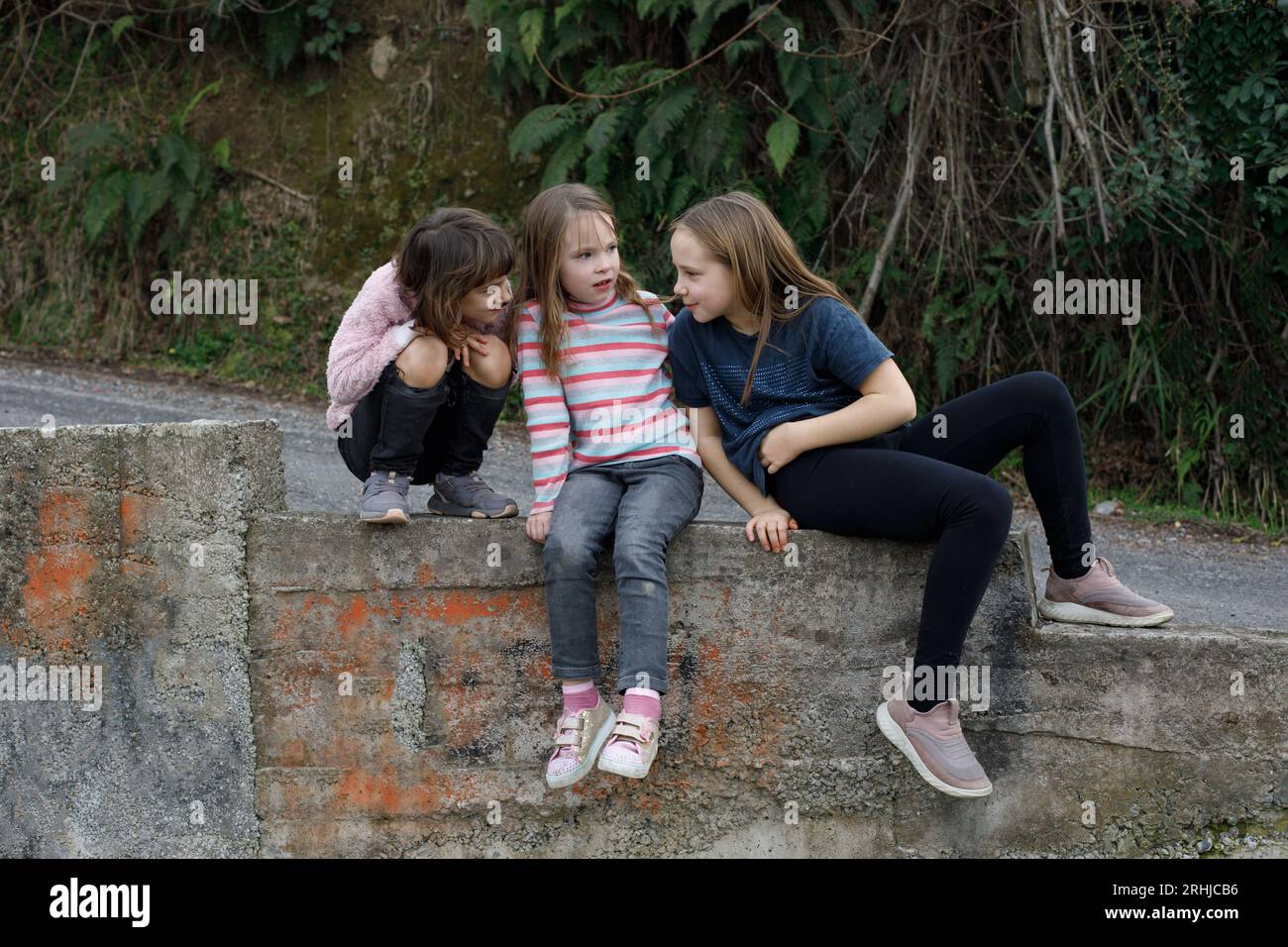 Cute kids chatting and playing together outdoor Stock Photo - Alamy