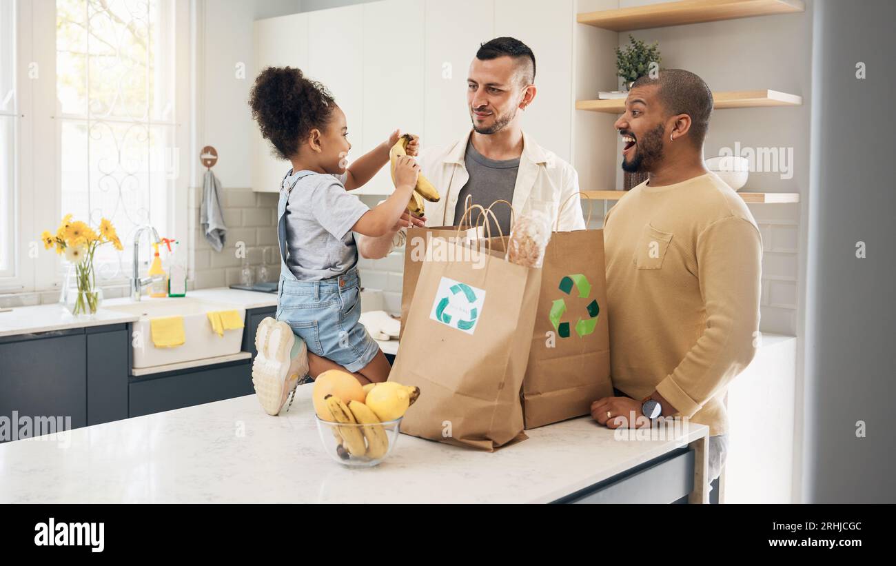 Recycling, blended family or adoption with a girl and gay couple in the ...