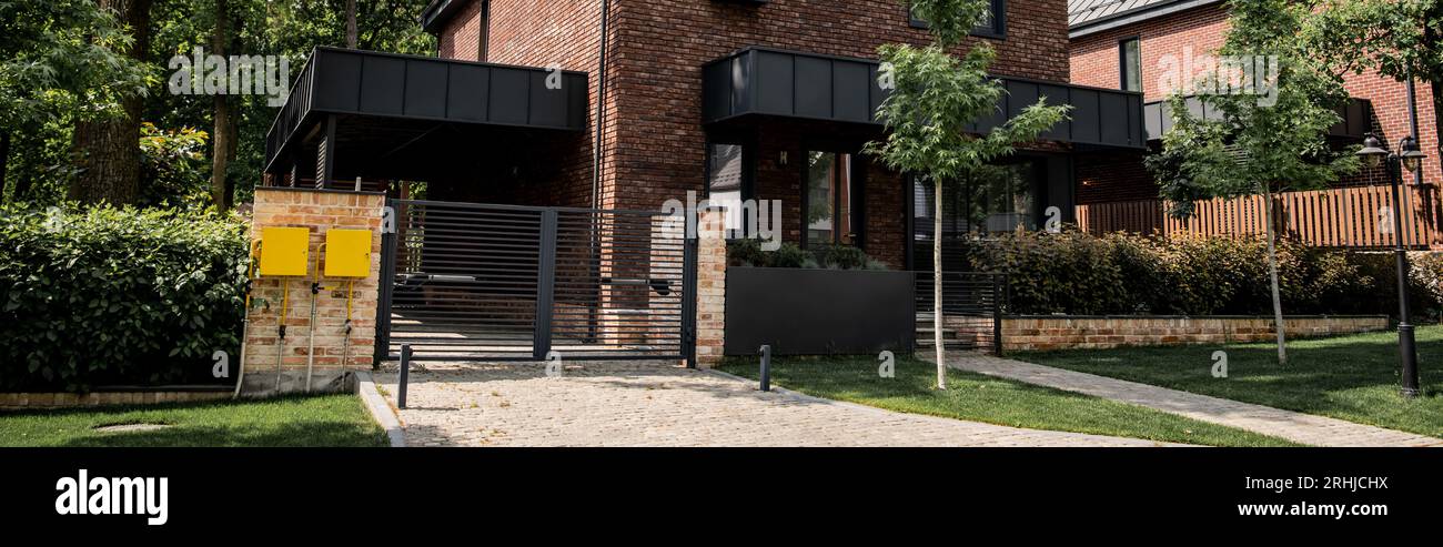 contemporary city cottage, brick walls, metal gates, real estate market ...