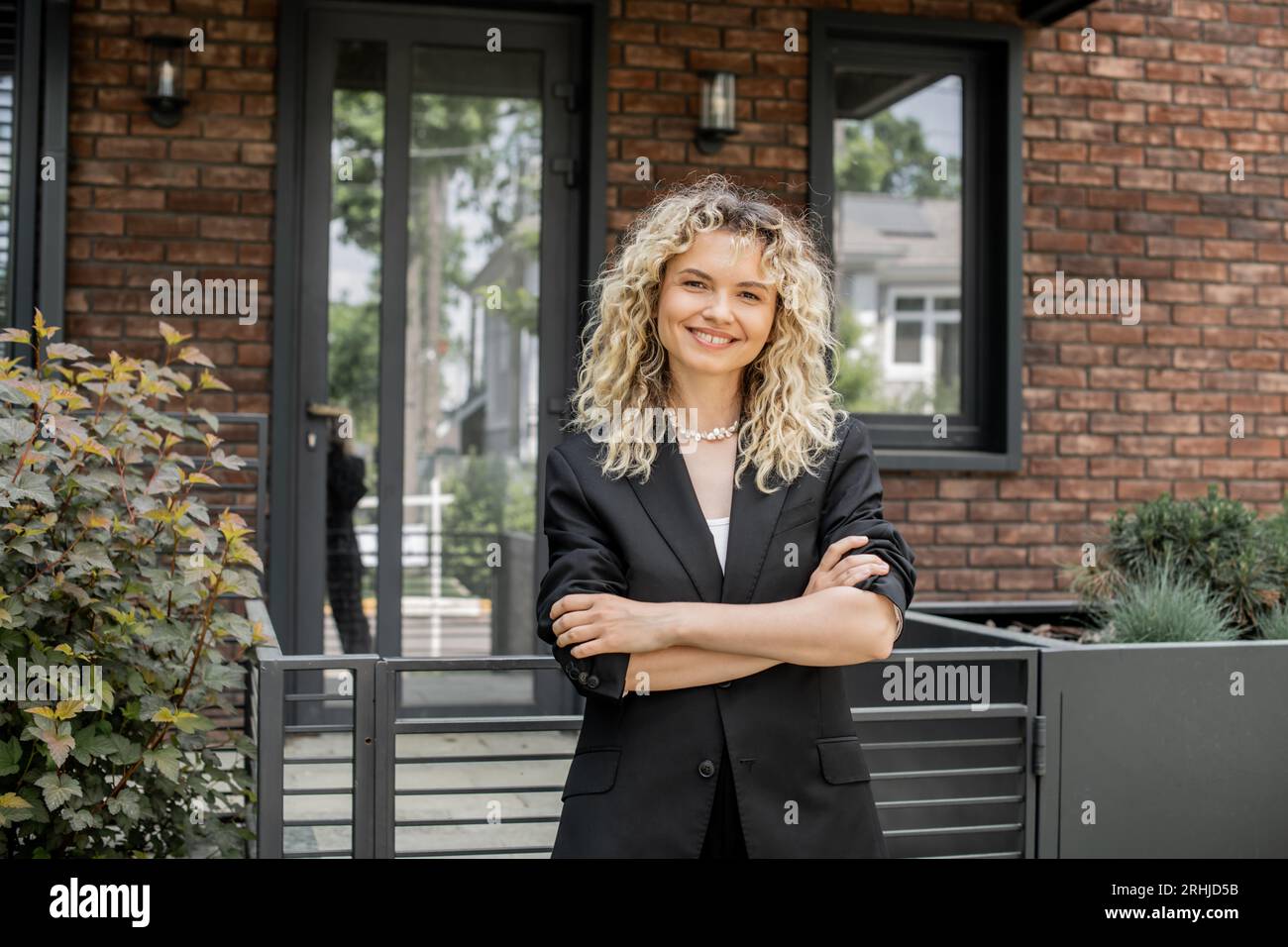 Happy estate agent folded hi-res stock photography and images - Alamy