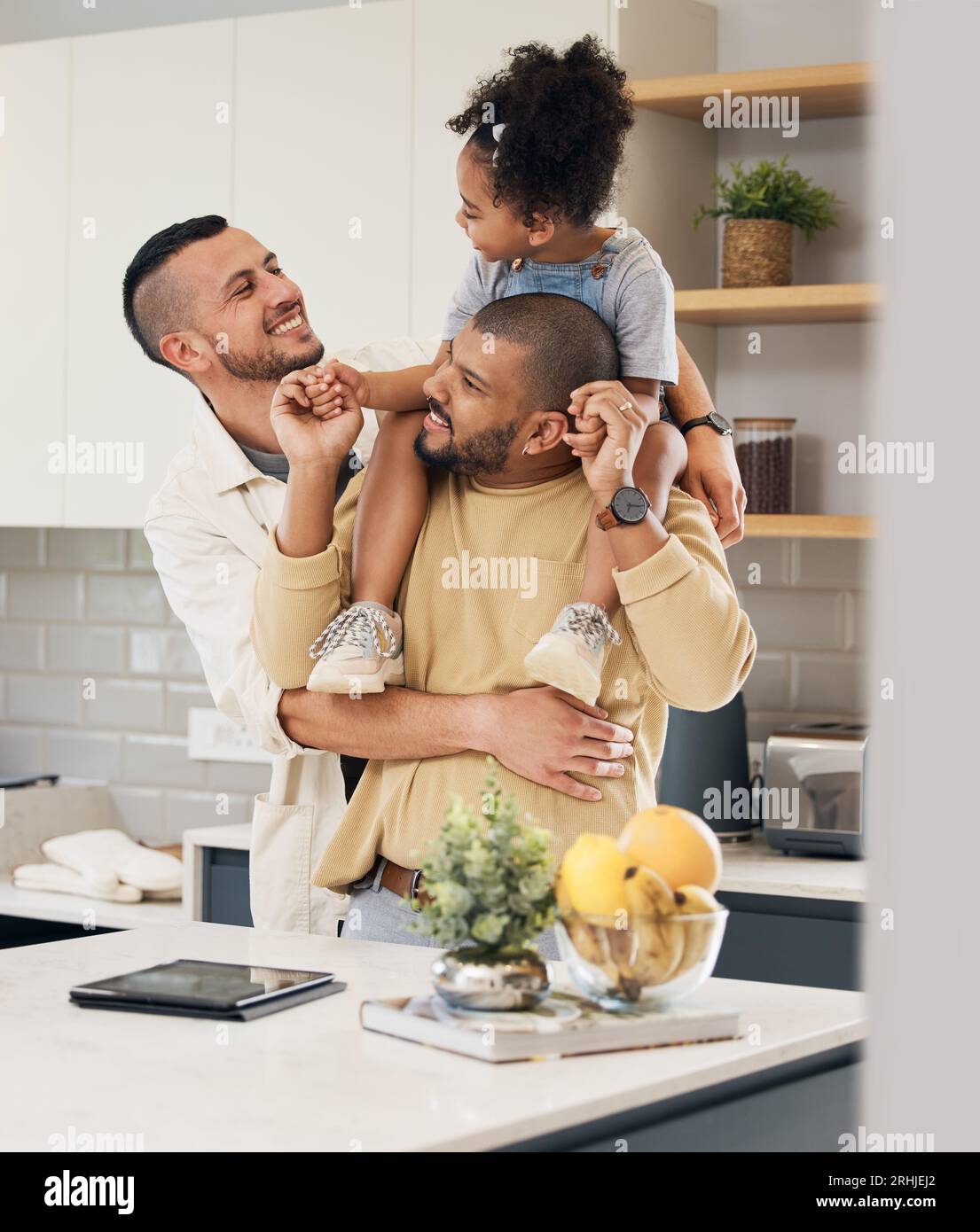Happy family, child and gay parents in home together with love, support ...