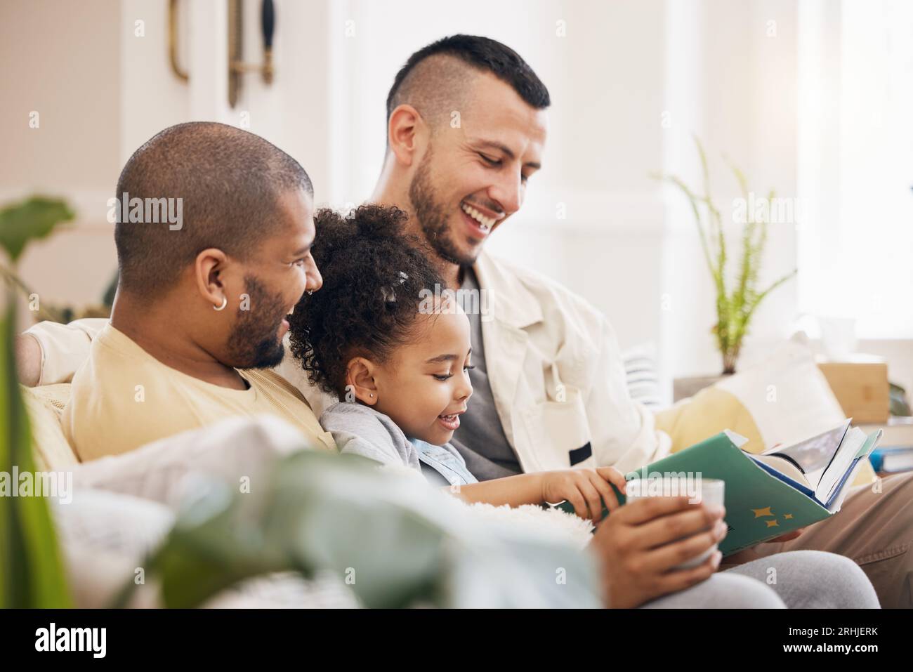 Gay couple, girl and reading book on sofa with smile, bonding and love ...