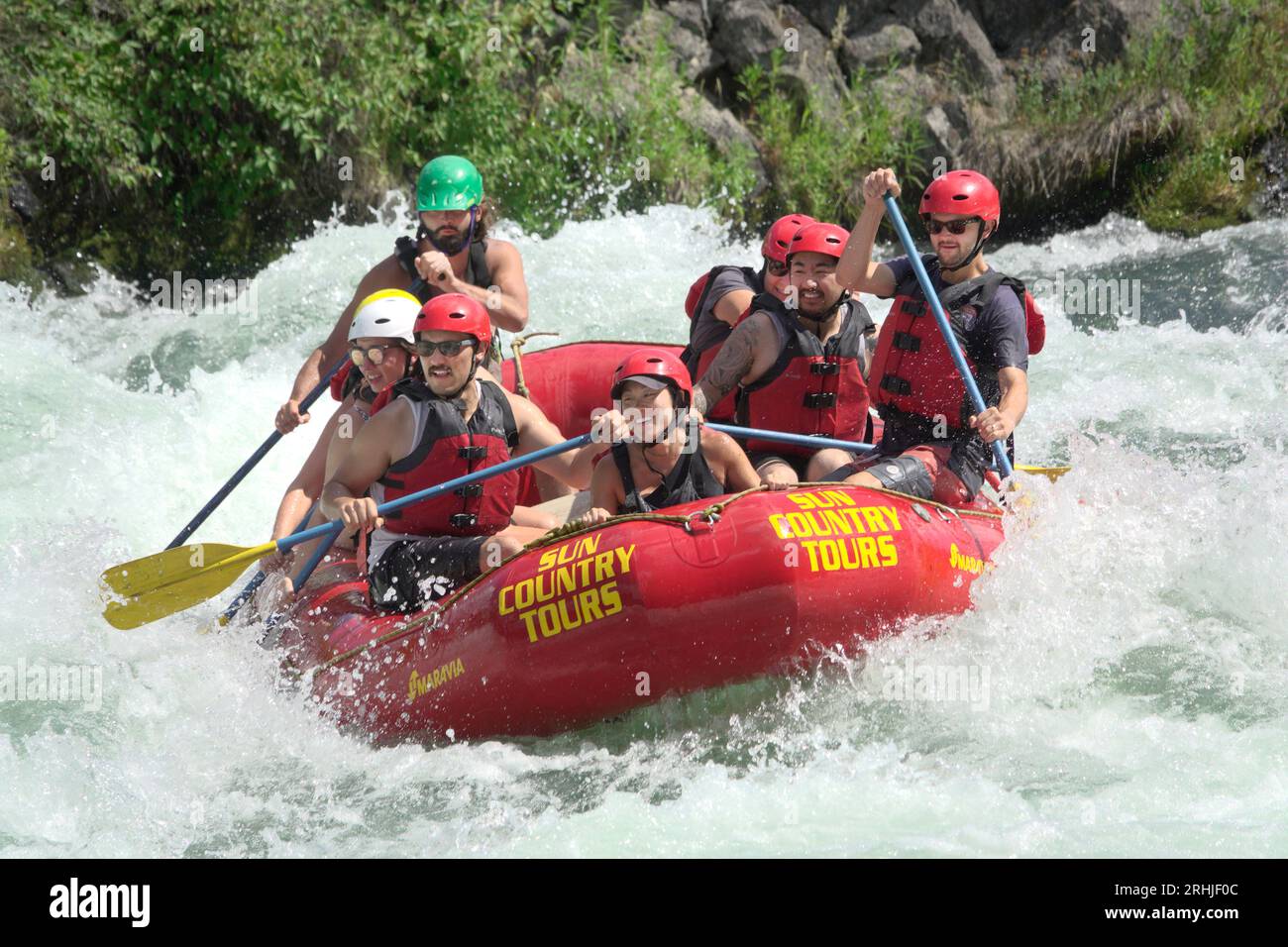 White water rafters in a paddleboat enjoy a hot summer day on the Upper ...