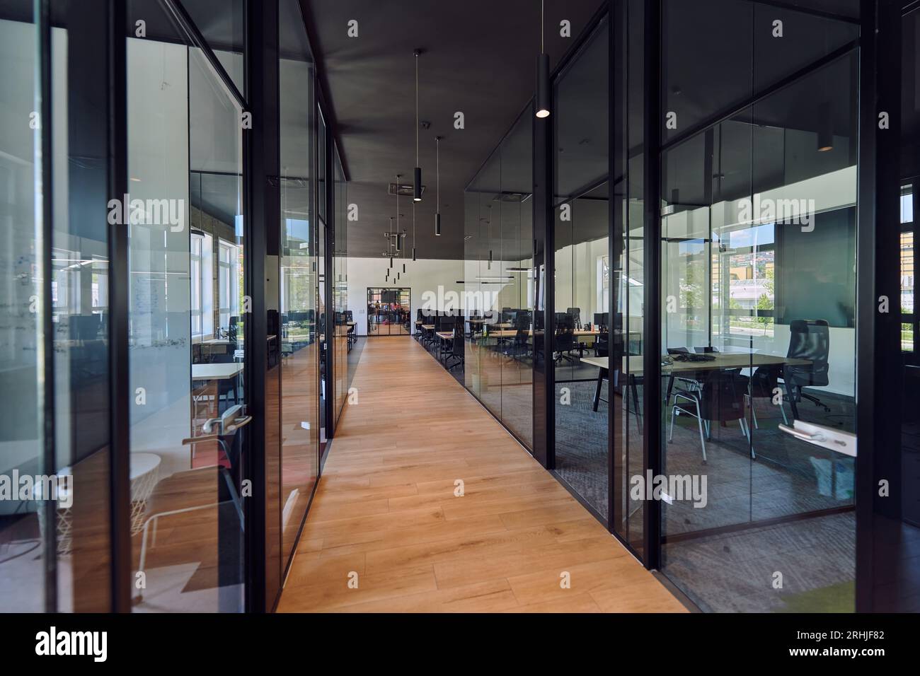 In a setting of modern, glass-walled business startup offices, the open ...