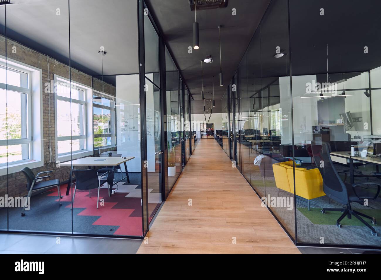 In a setting of modern, glass-walled business startup offices, the open ...