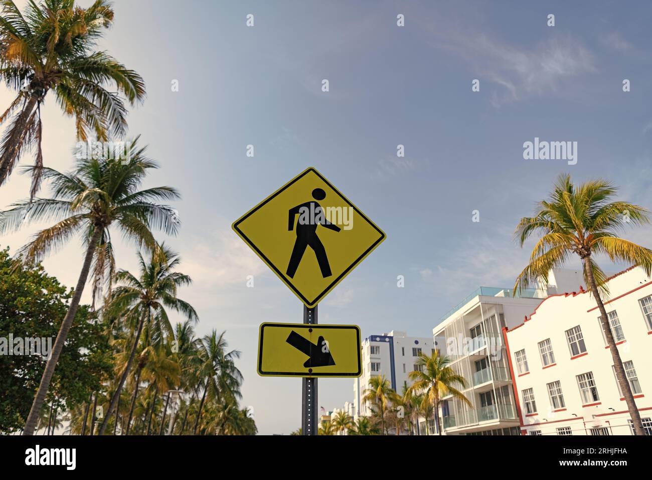 Yellow pedestrian crossing road traffic sign with pointing arrow plaque ...