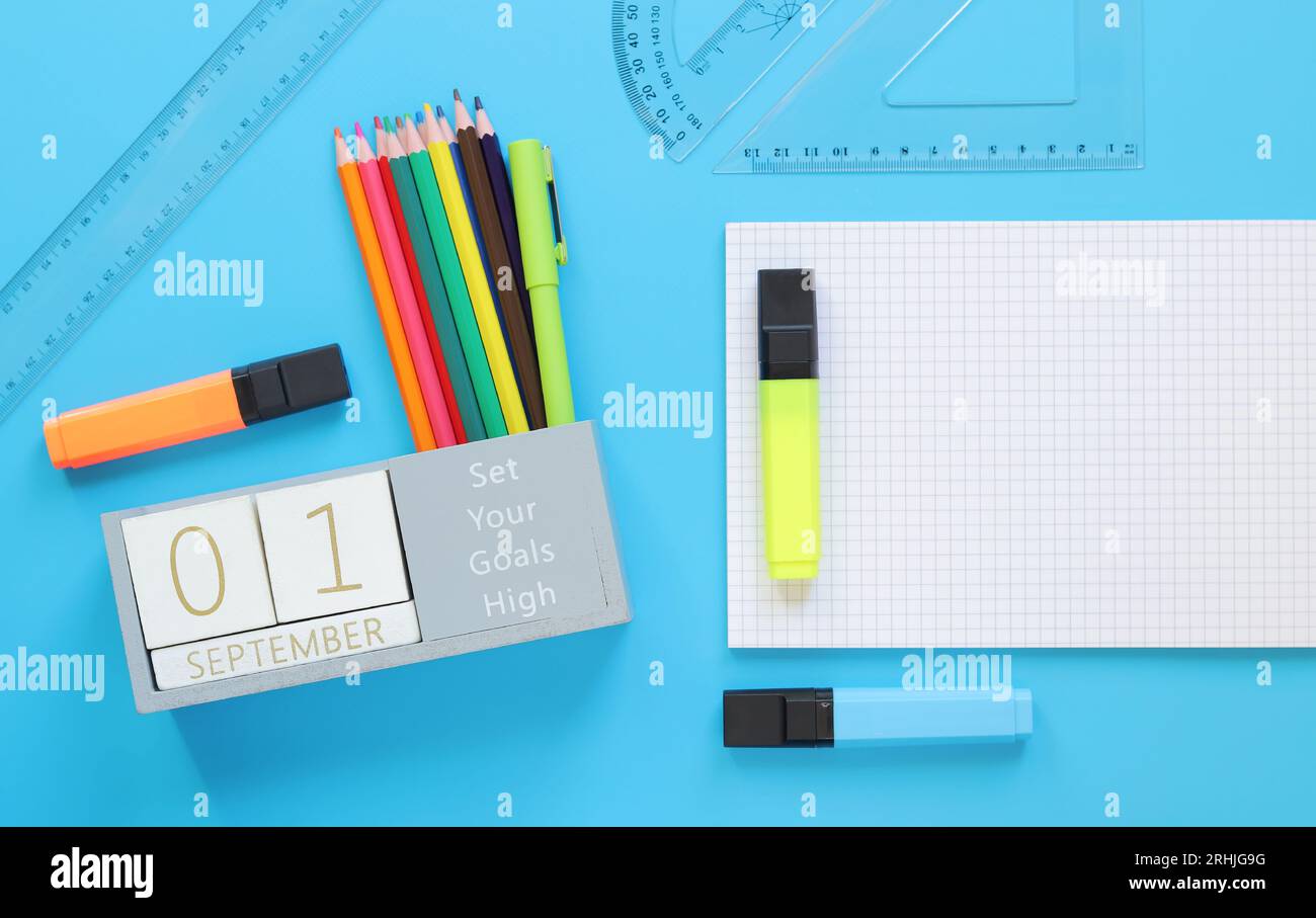 01 September. Image of a wooden calendar for September 1 on a blue ...