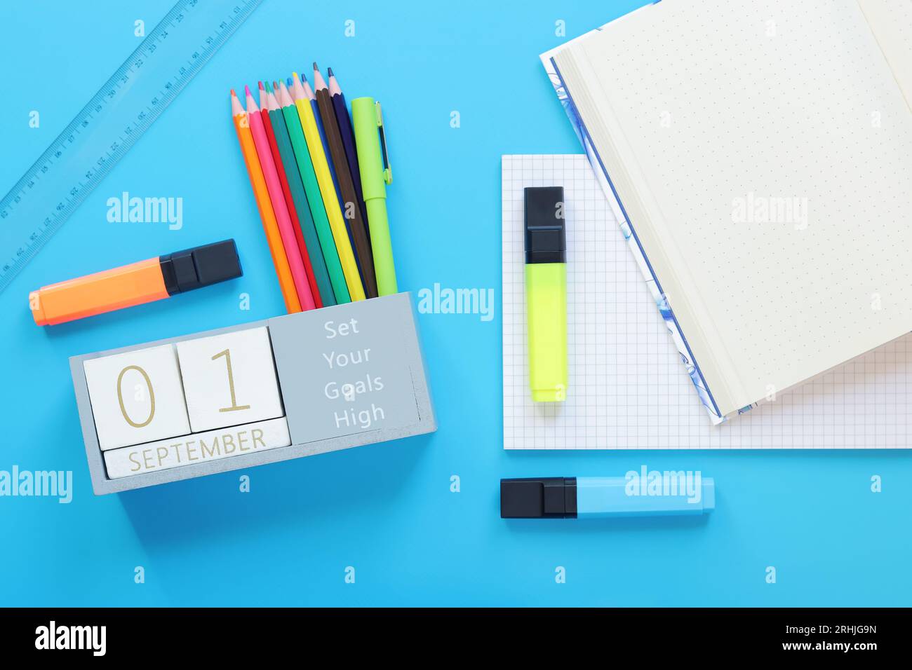 01 September. Image of a wooden calendar for September 1 on a blue ...