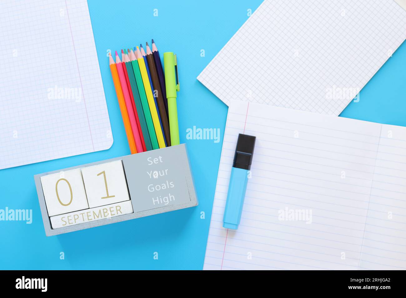 01 September. Image of a wooden calendar for September 1 on a blue ...