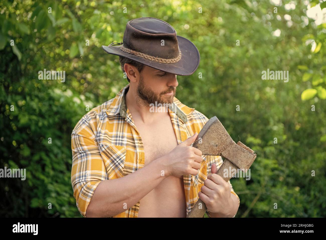 photo of rancher man with axe. rancher with axe. rancher with axe ...