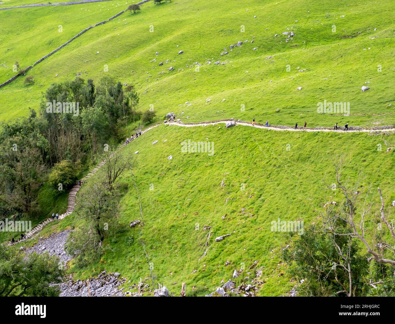 Hikers on the stepped path to the top of Malham Cove, Yorkshire Dales ...