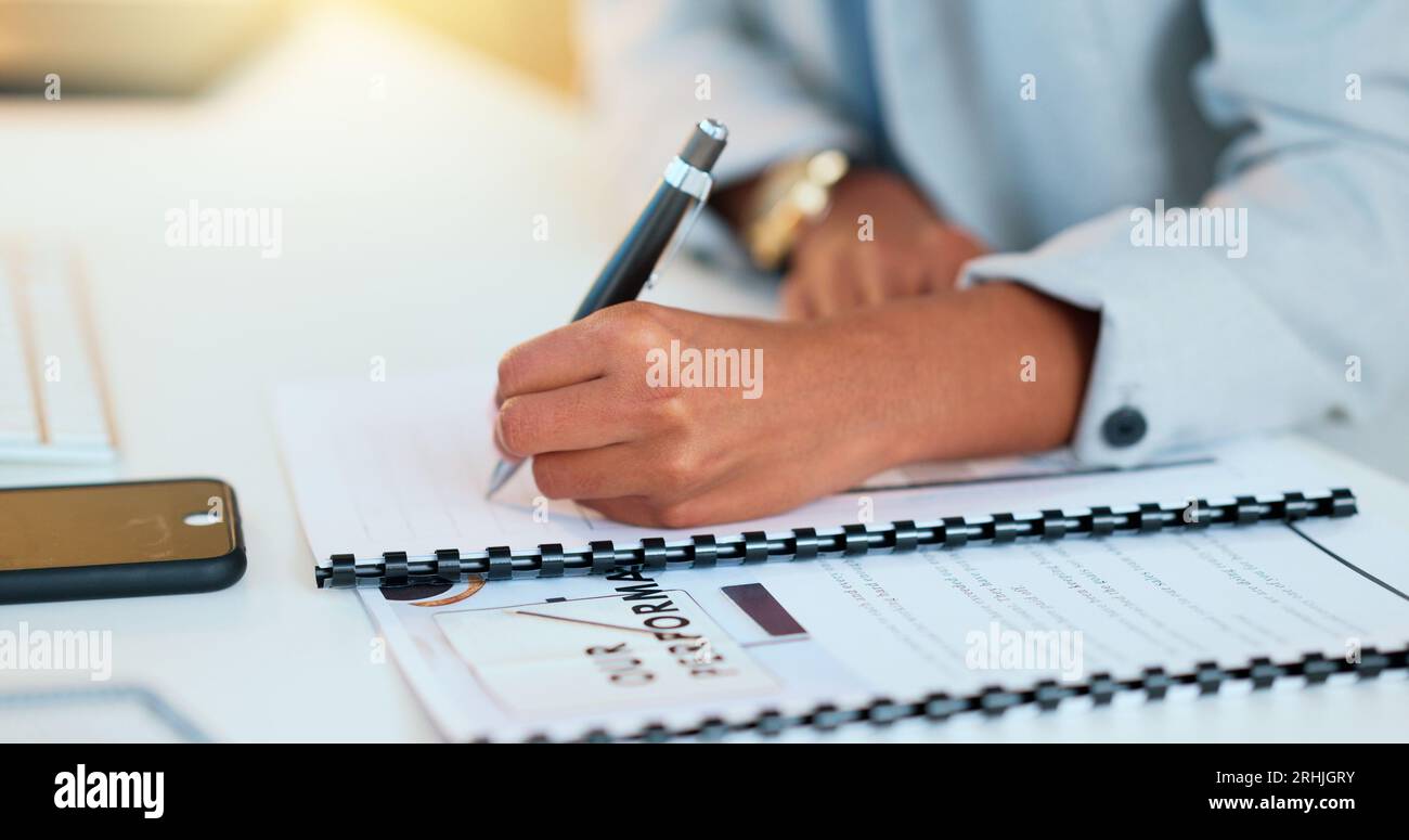 Closeup man hands filling in company paperwork. Professional individual ...