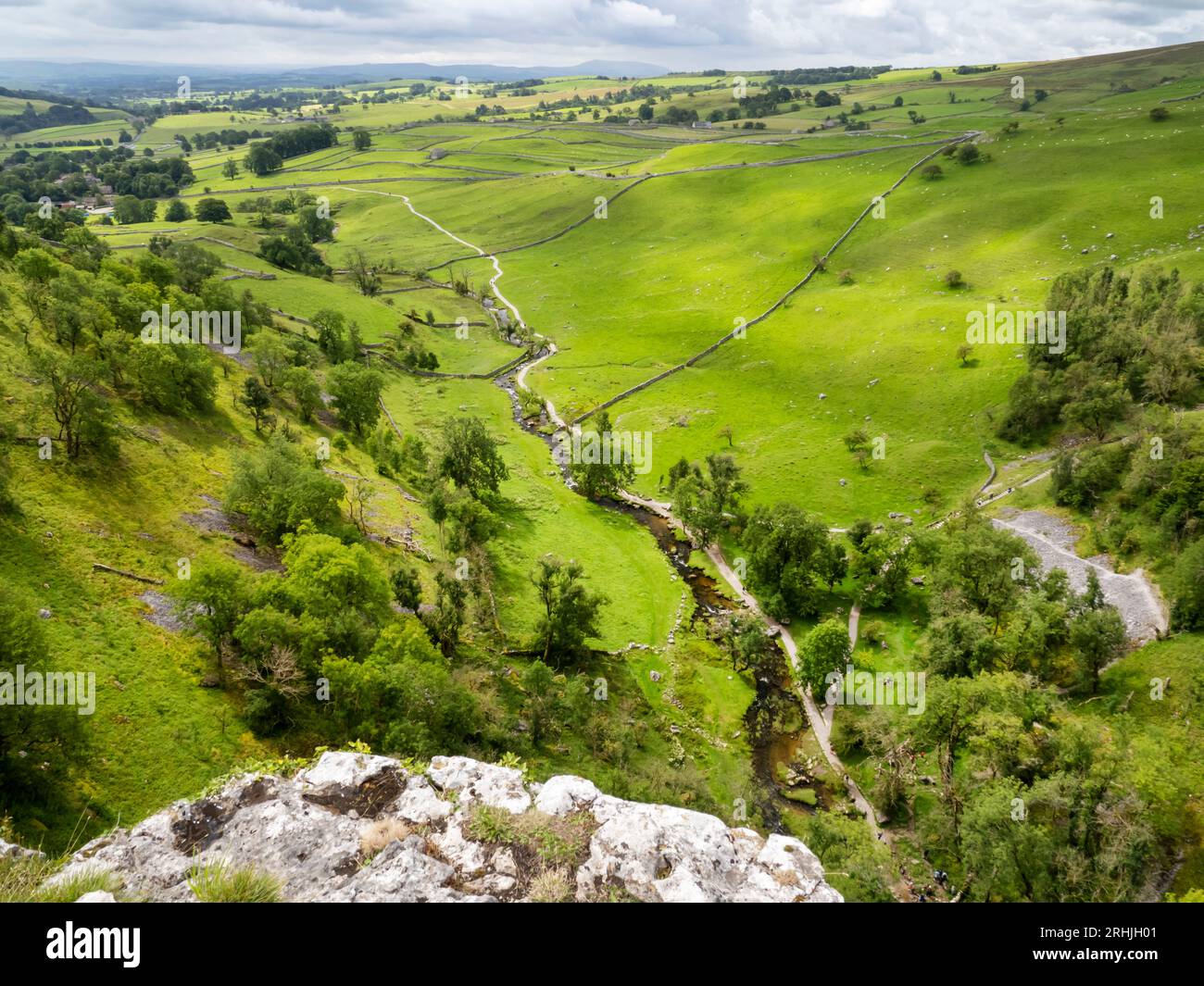 The resurgance of Malham Beck at the base of Malham Cove, Yorkshire ...