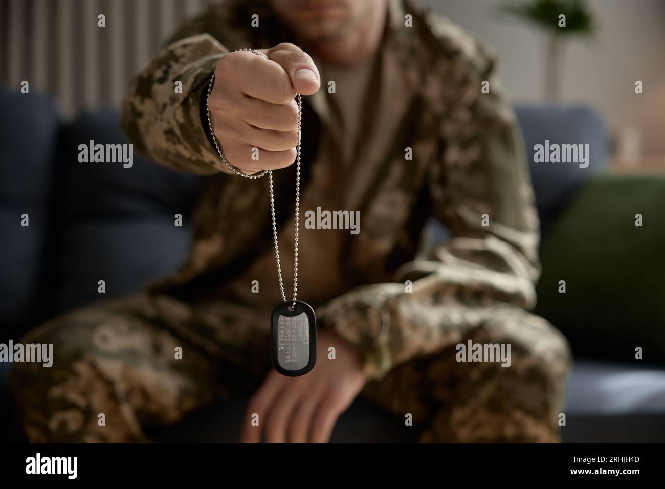 Closeup military hand holding metallic badge dog tag with qr code Stock ...