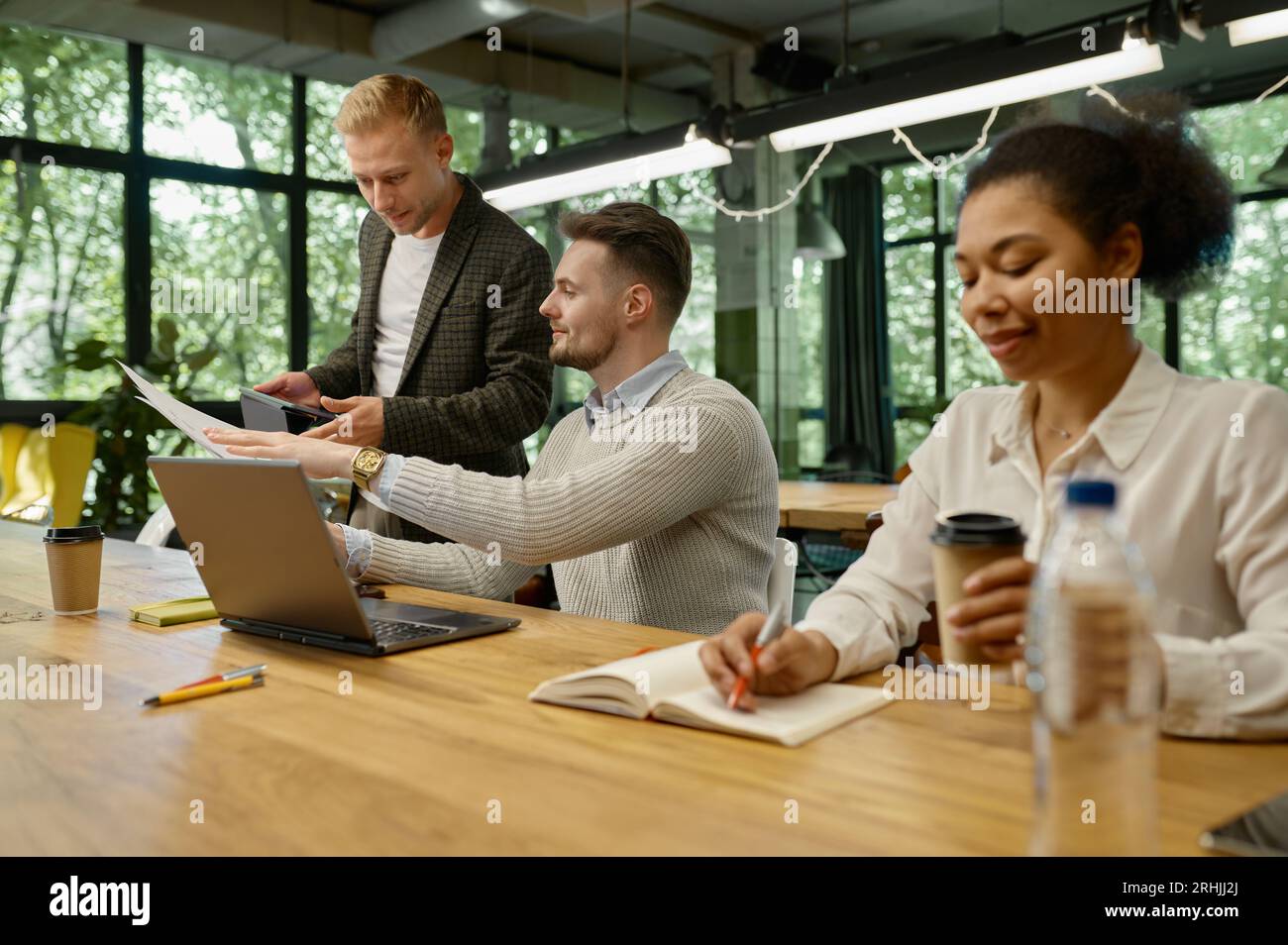 Business team talking, working together at coworking office open space ...