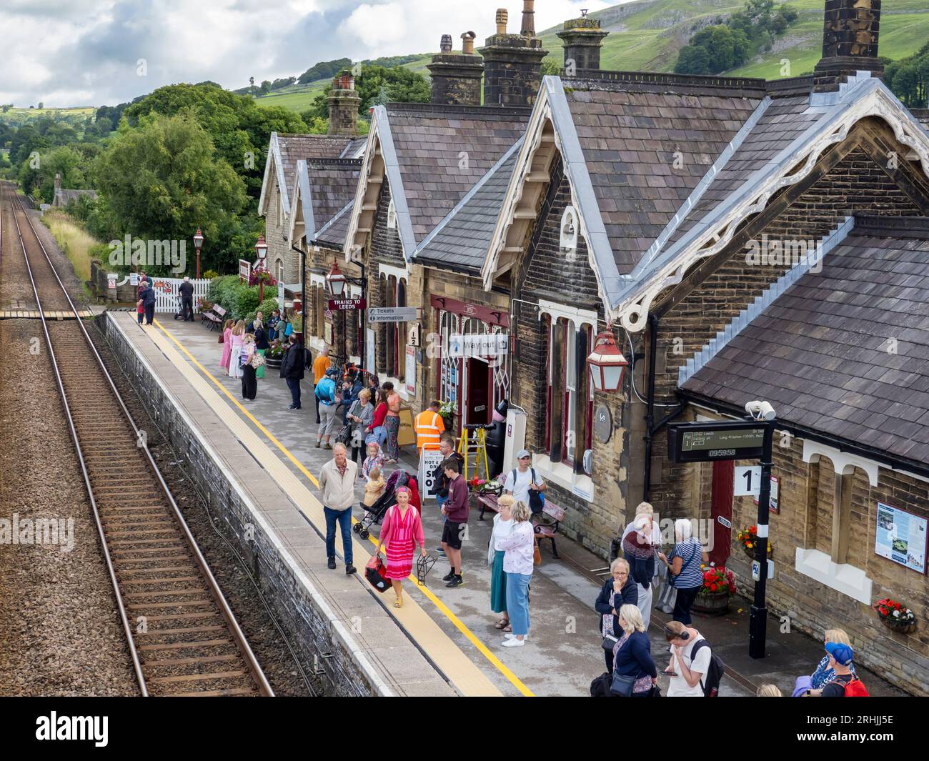 Passengers on the platform at Settle Station on the Settle-Carlisle line, Settle, Yorkshire ...