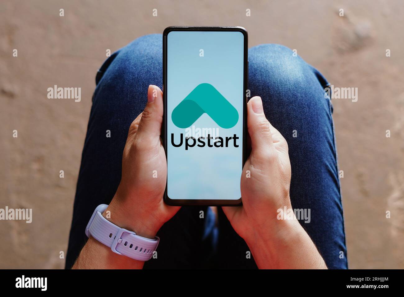 In this photo illustration, the Upstart logo is displayed on a ...