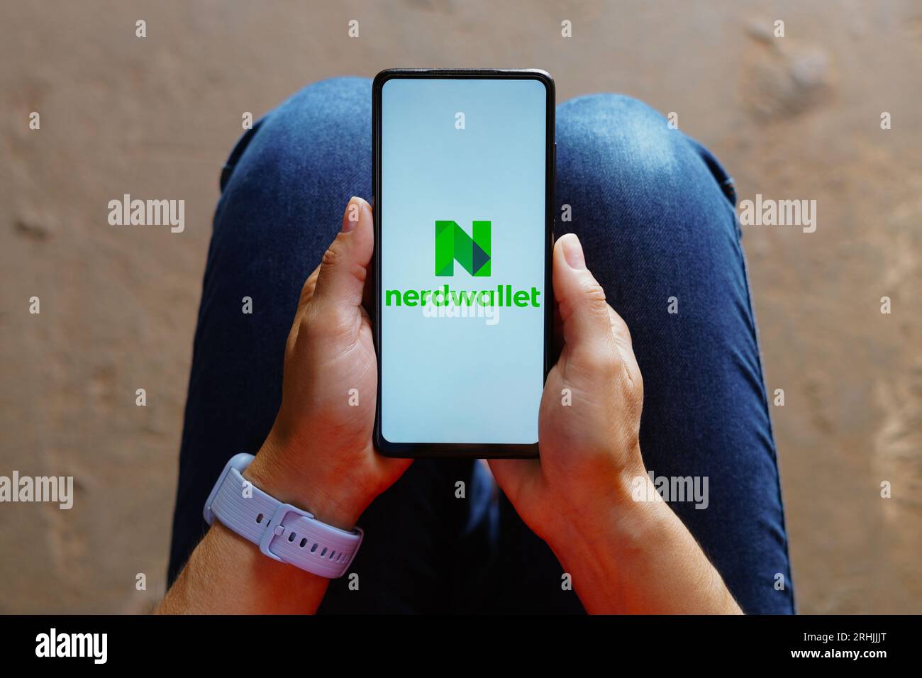 In this photo illustration, the NerdWallet logo is displayed on a ...