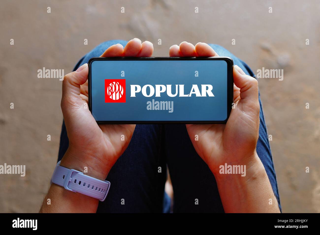 In this photo illustration, the Popular, Inc. logo is displayed on a ...